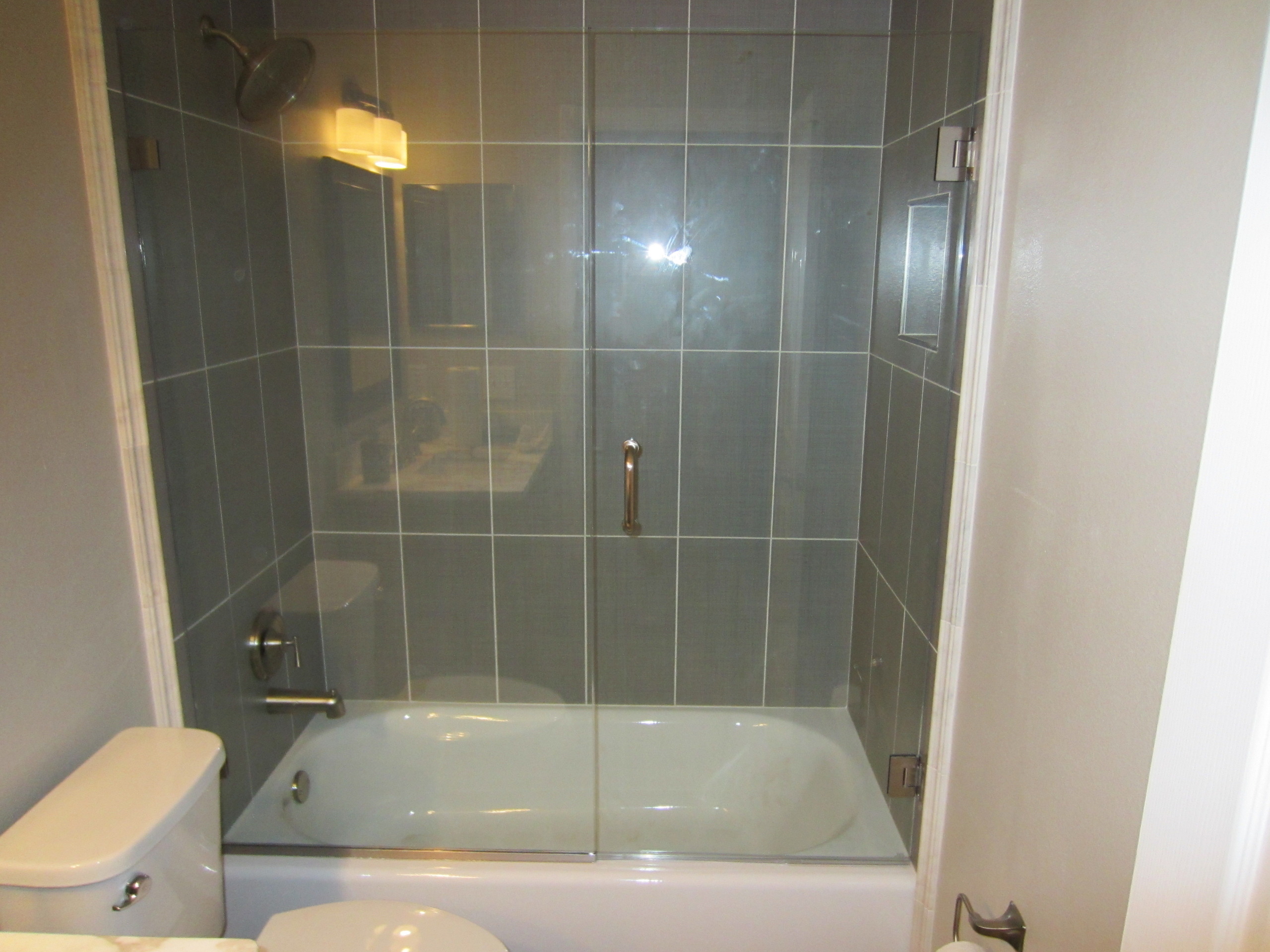 Inline Panels & 3/8" Frameless Glass Shower Doors in Orlando